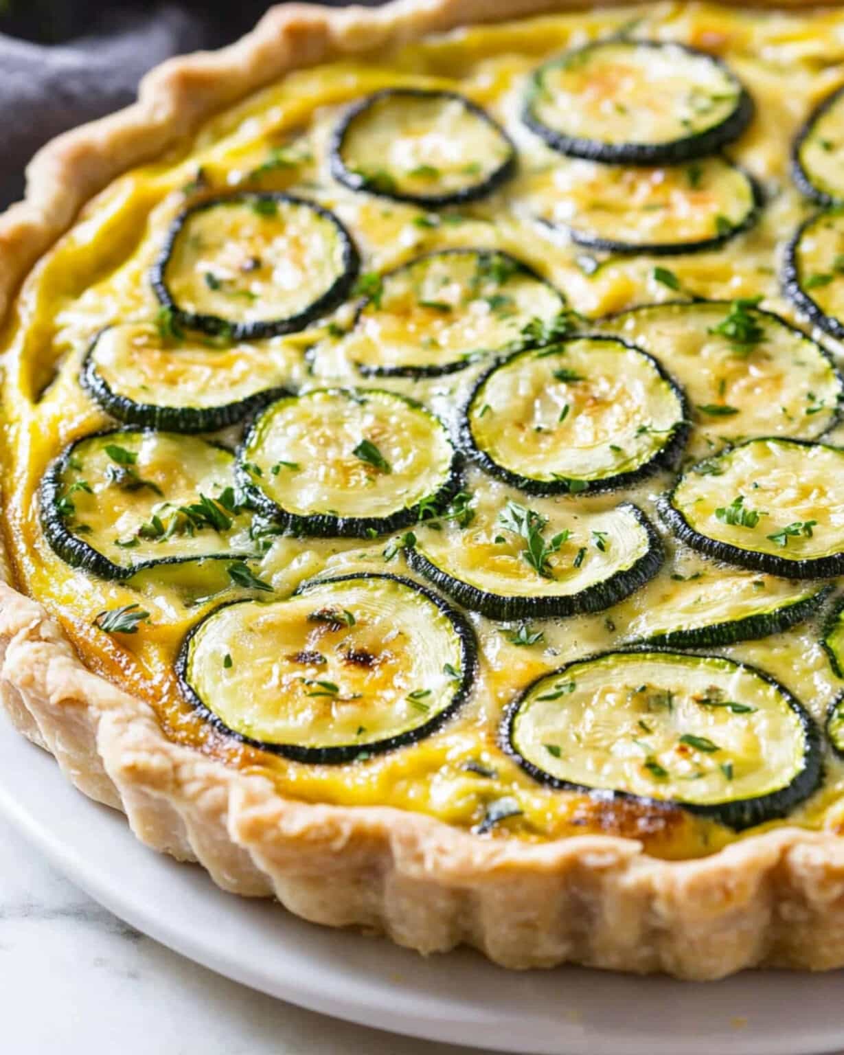 Cheesy Zucchini Quiche Recipe - YummyHere
