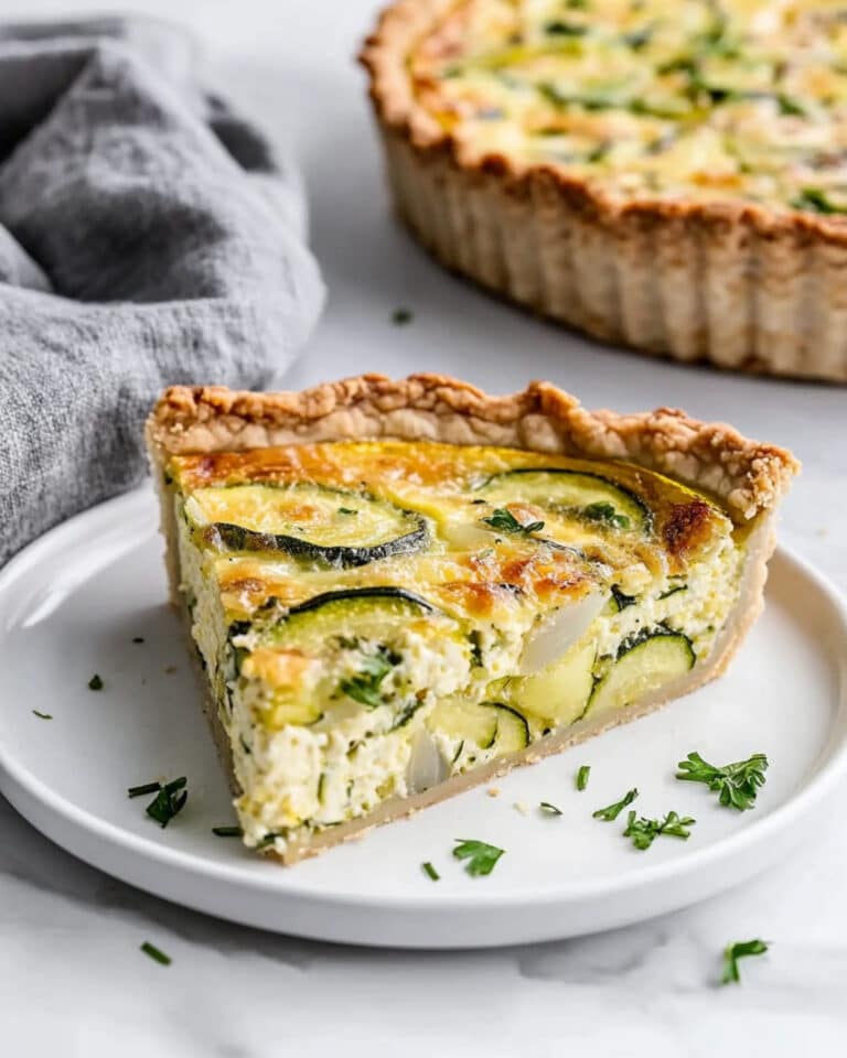 Cheesy Zucchini Quiche Recipe - YummyHere