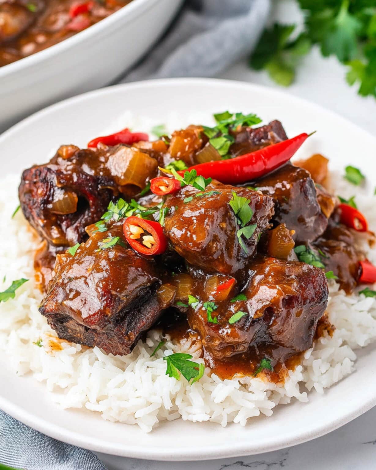Southern Style Braised Oxtails Recipe - YummyHere